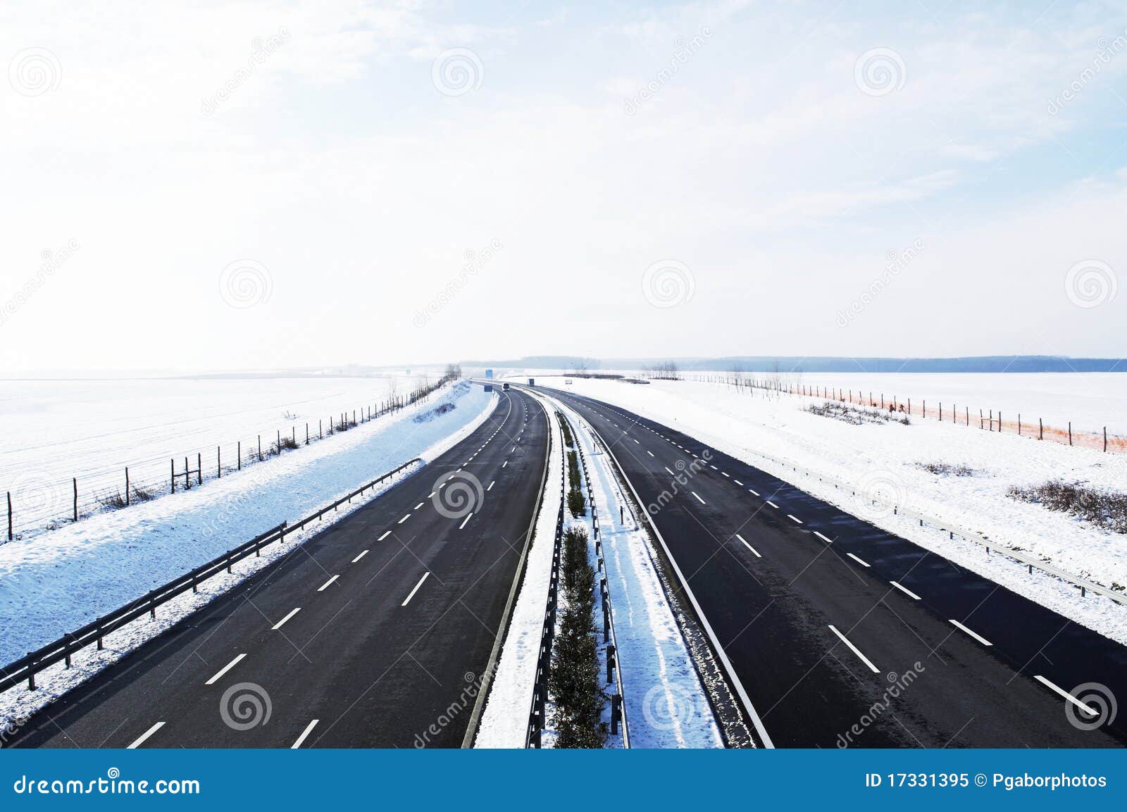Four Lane Road With A Pedestrian Crossing Warning Sign In The Traffic ...