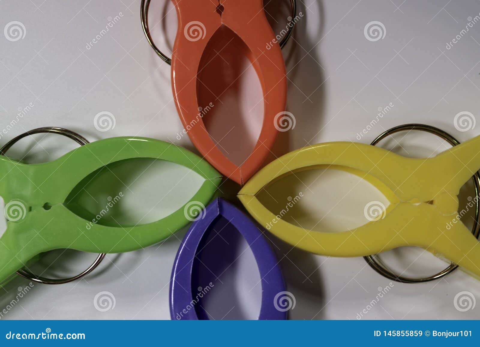 Four Large Cloth Clamps in Various Colors on a White Background. Stock ...