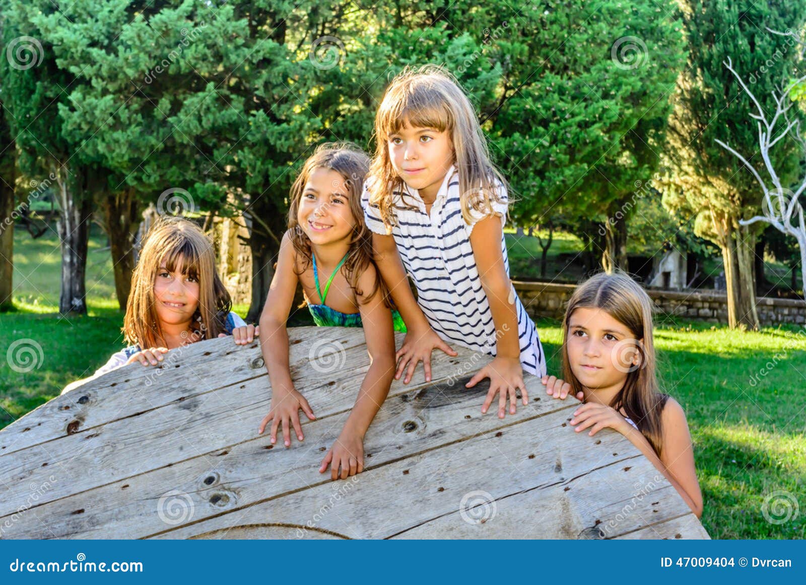 Four Little Girls Playing in the Park Stock Photo - Image of girls ...