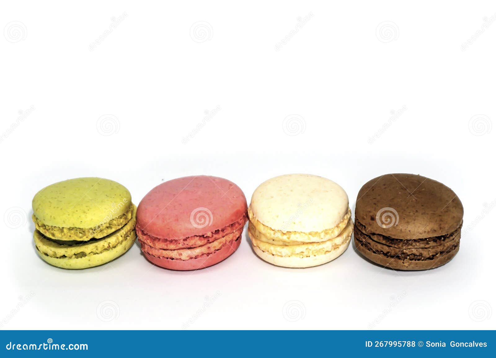Four macarons in a row stock photo. Image of snacks - 267995788