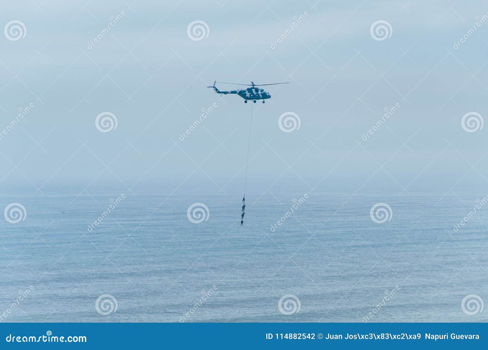 Four Man Climb from Helicopter Down a Rope Stock Photo - Image of ...