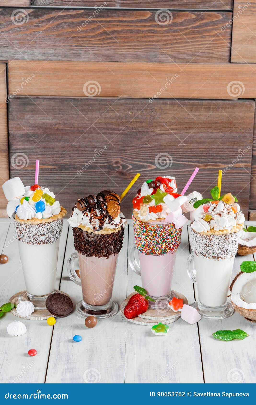 Four Milkshakes On The Background Of Blue Wall Royalty-Free Stock ...