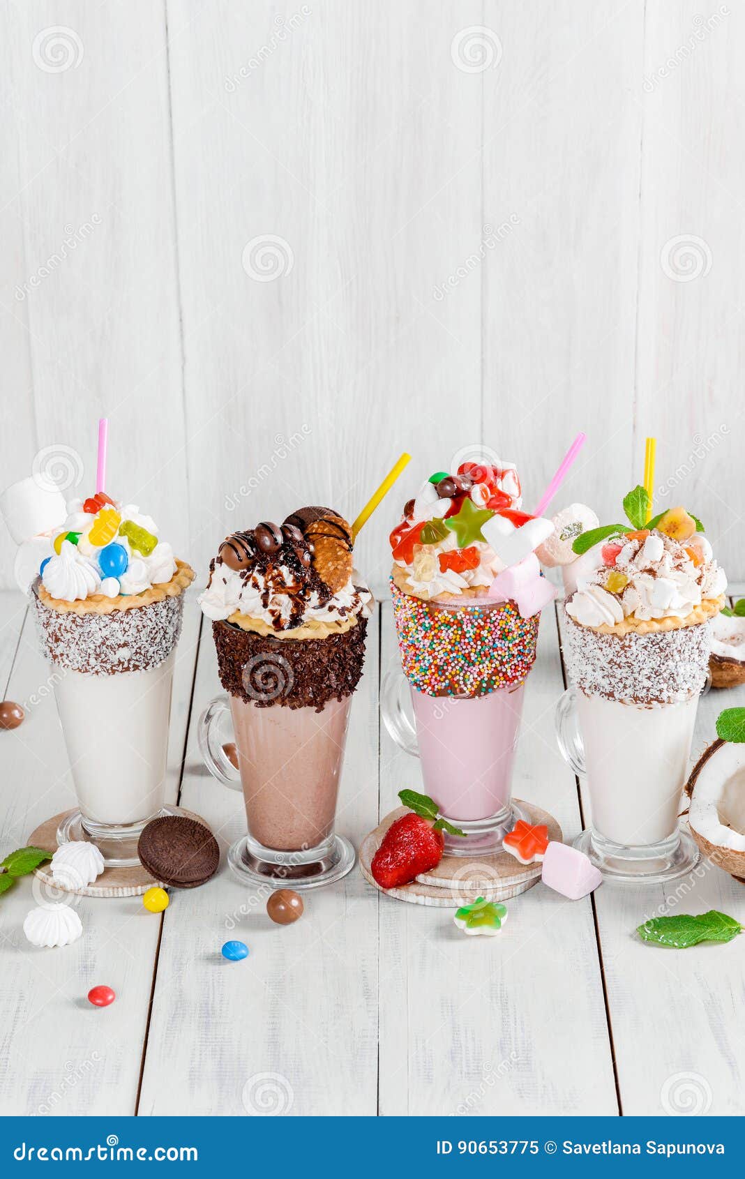 Four Milkshakes On The Background Of Blue Wall Royalty-Free Stock ...