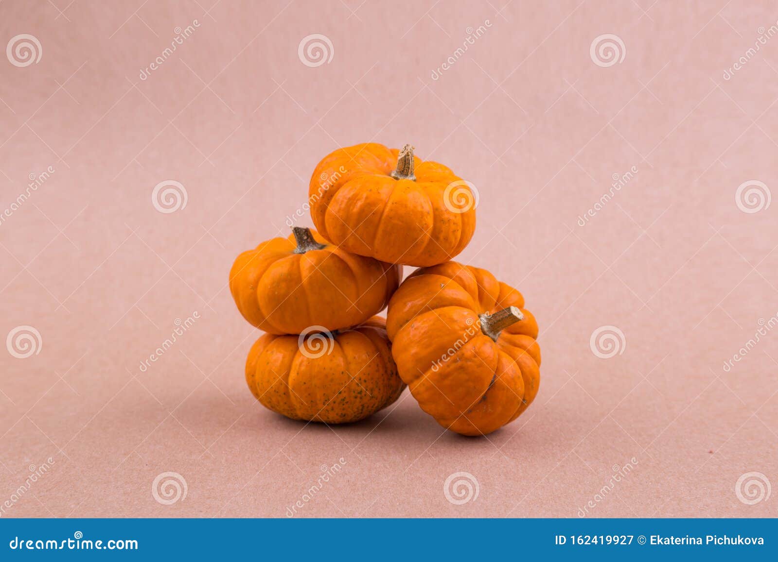 Four Mini Pumpkins for Halloween on the Paper. Decor. Stock Image ...