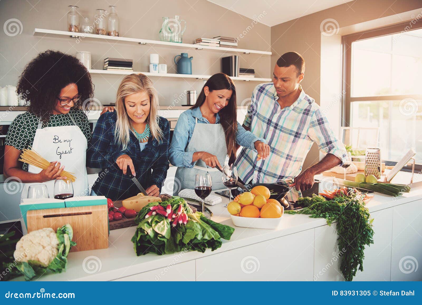 Four Mixed Friends Preparing a Meal in Kitchen Stock Image - Image of ...