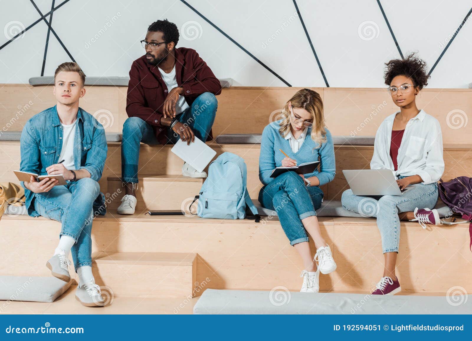 Four Multicultural College Students Friends, Male And Female, Standing ...