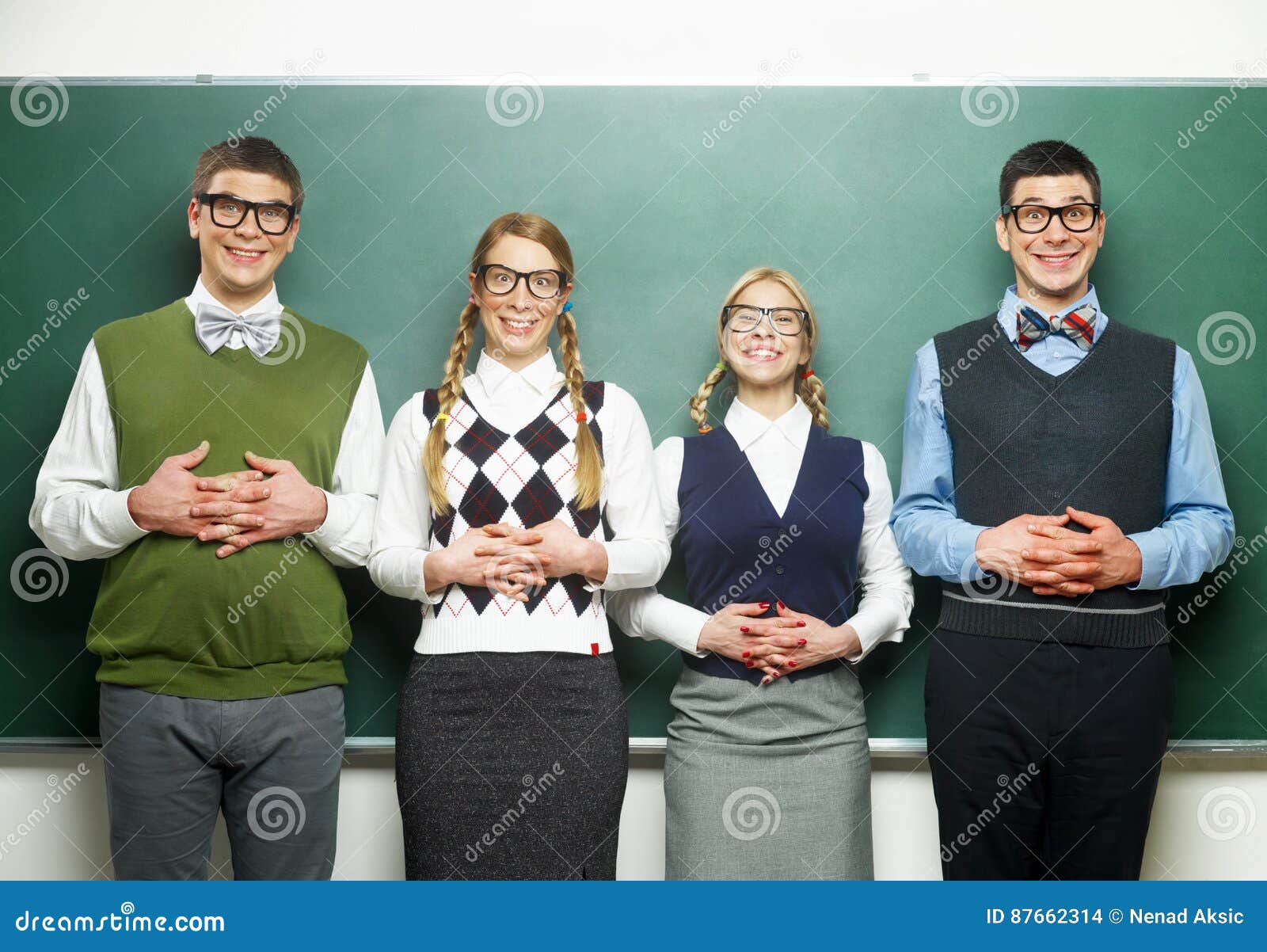 Four Nerds in Front of Blackboard Stock Photo - Image of group, adult ...