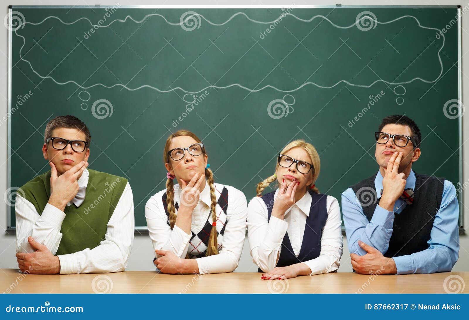 Four nerds thinking stock image. Image of book, classroom - 87662317