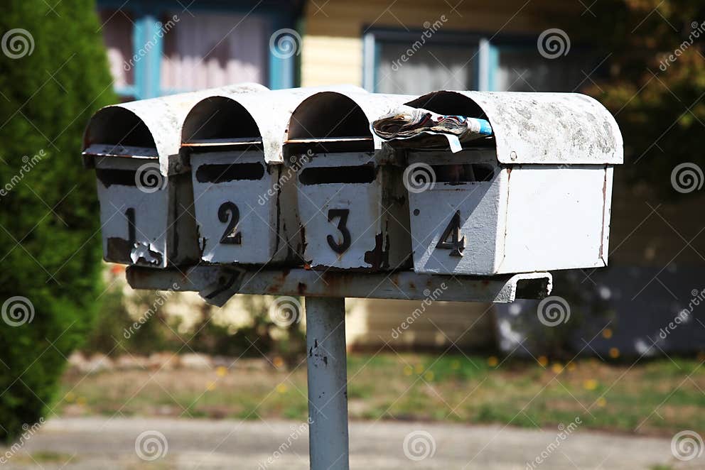 Four Mailboxes with Numbers on Them Stock Image - Image of curved ...