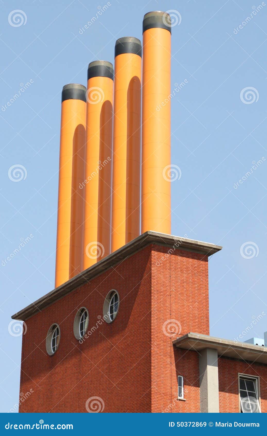 Four orange chimneys stock image. Image of structure - 50372869