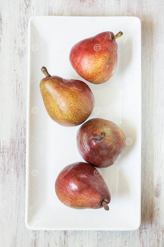 Four Pears on White Dish stock image. Image of cook, cuisine - 42240271