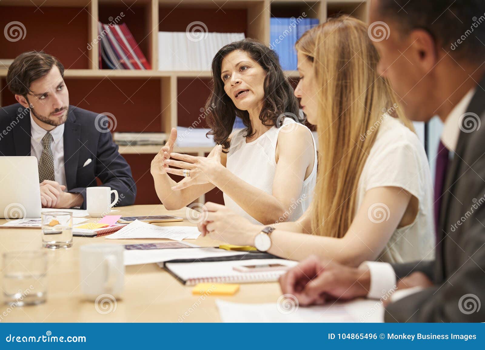 Four People at a Business Boardroom Meeting Stock Photo - Image of ...