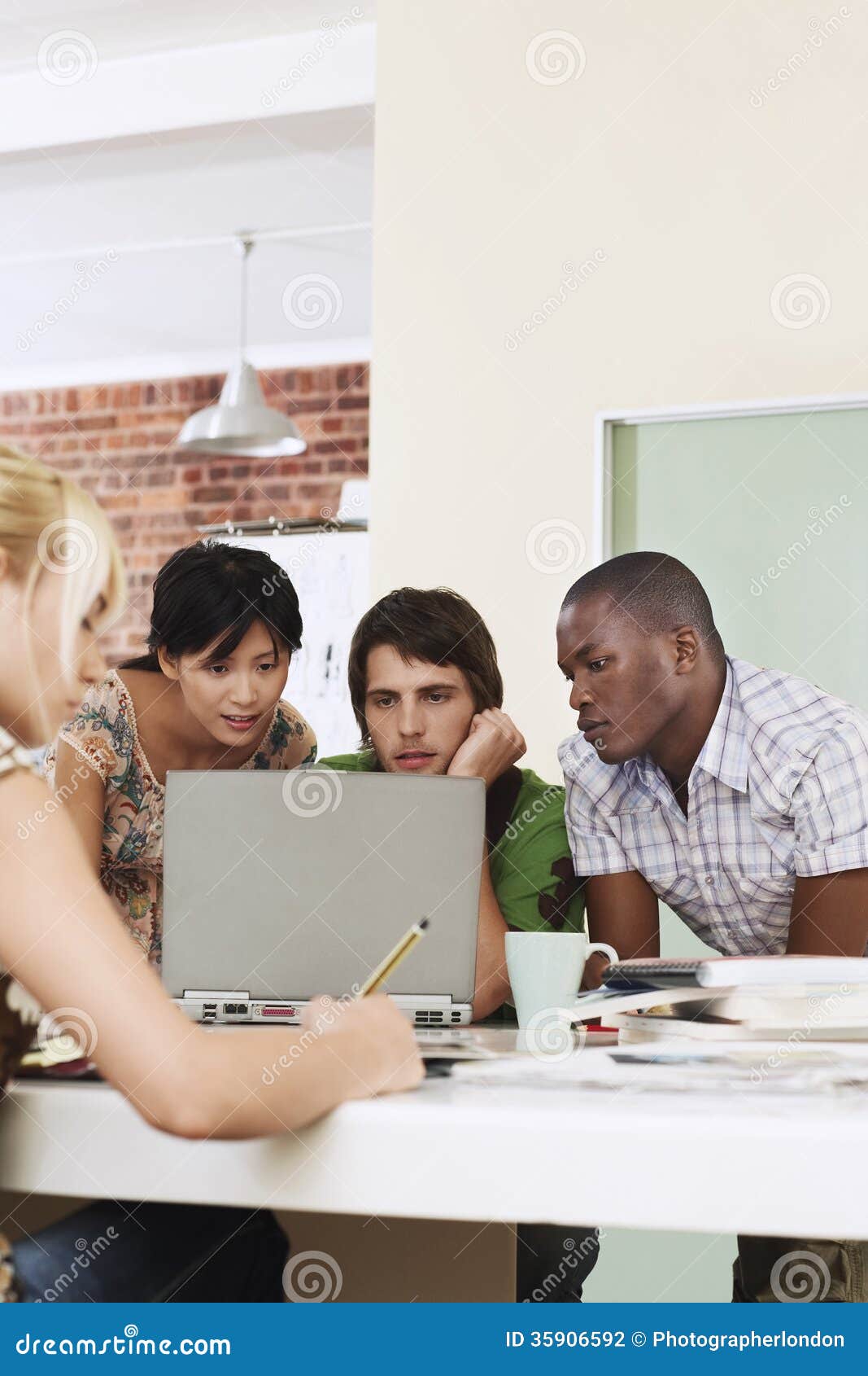 Four People Having Meeting Around Laptop. Stock Photo - Image of ...