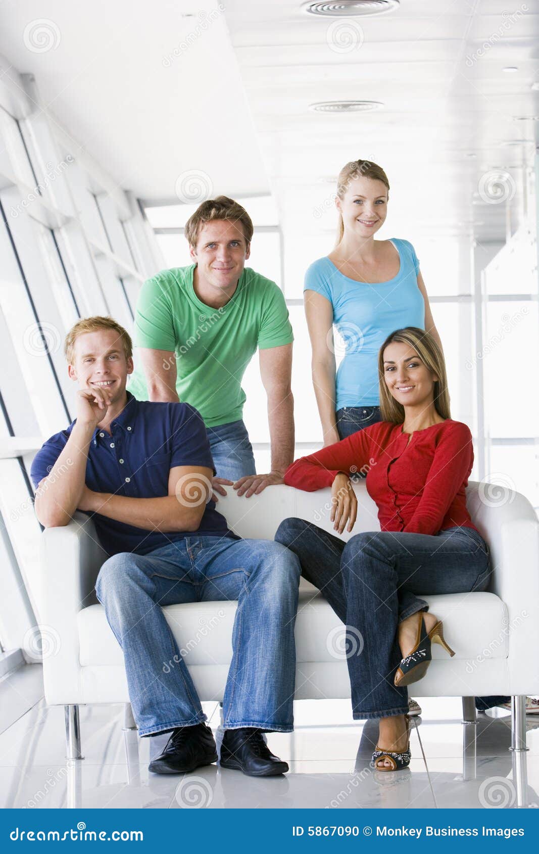 Four People in Lobby Smiling Stock Photo - Image of angle, casual: 5867090