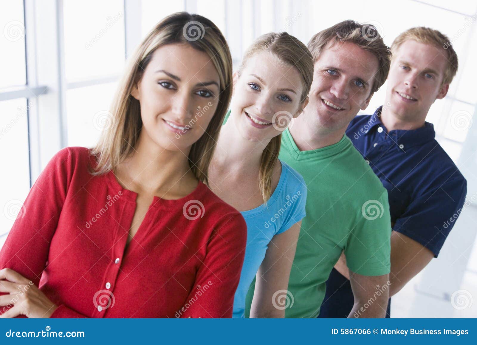 Four People Together Holding Their Hands Together In A Community With A ...