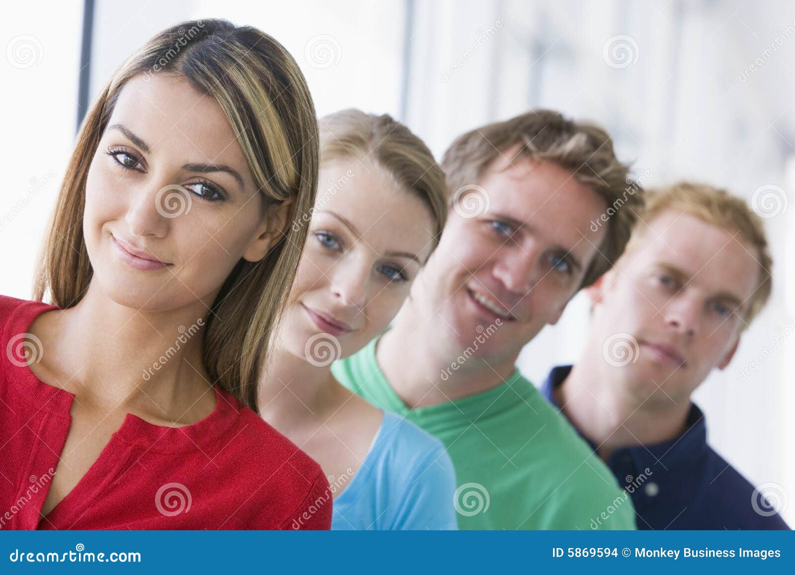 Four People Standing in Corridor Smiling Stock Photo - Image of male ...