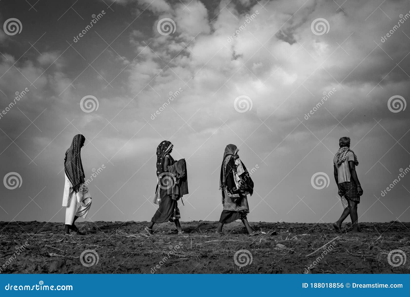 Four People Walking in One Direction with Clouds Above Editorial Photo ...