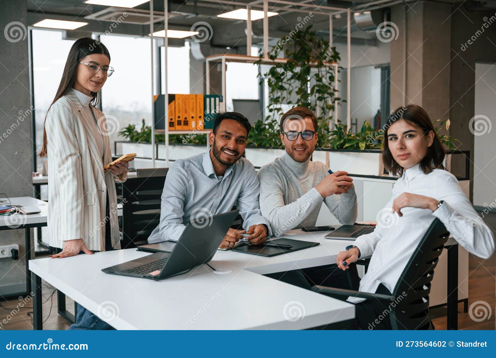 Four People are Working in the Office Together Stock Photo - Image of ...