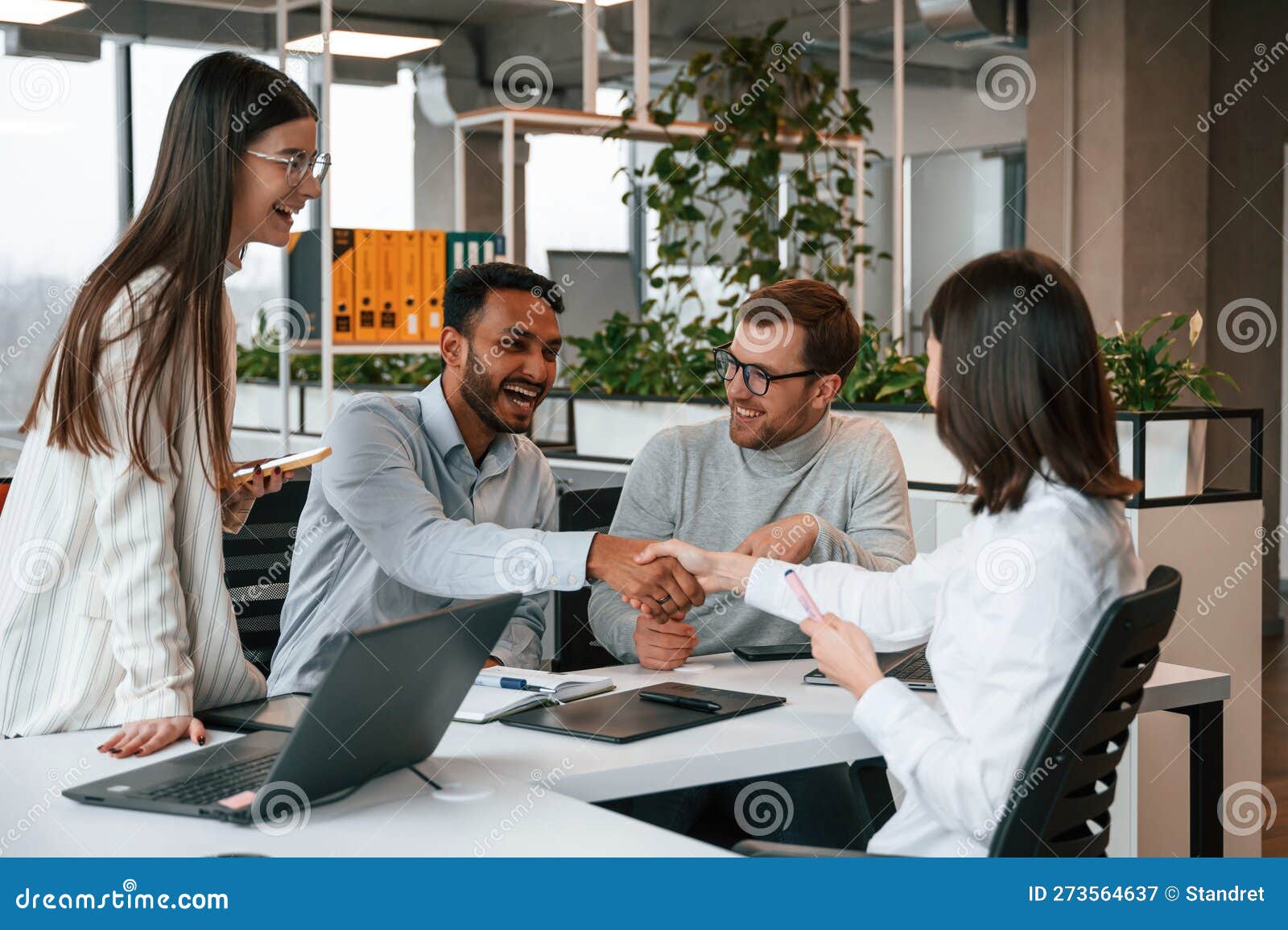 Four People are Working in the Office Together Stock Image - Image of ...