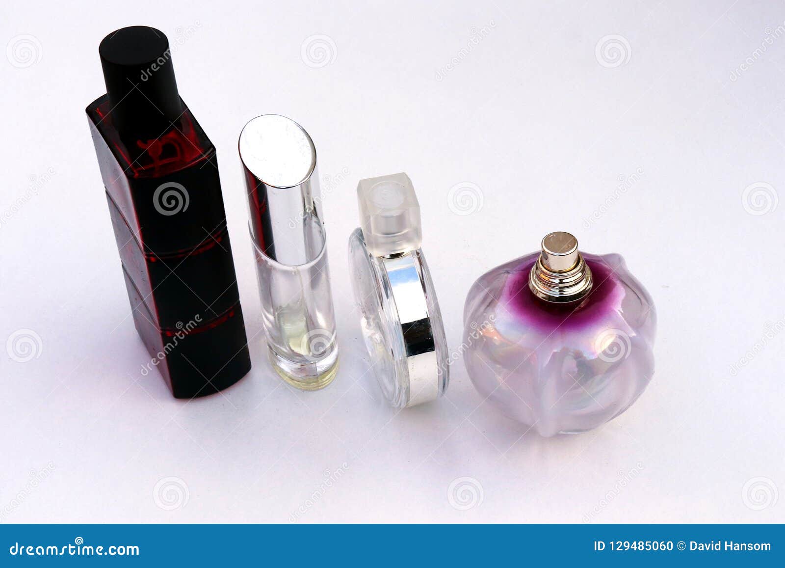 Four Perfume Bottles on a White Background Stock Photo - Image of ...