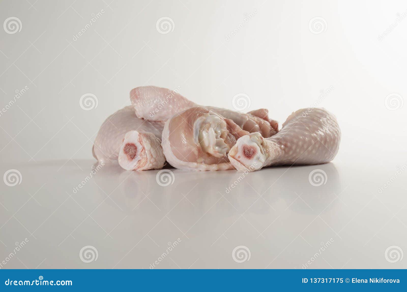 Four Pieces of Raw Chicken Meat on a Light Background Stock Image ...