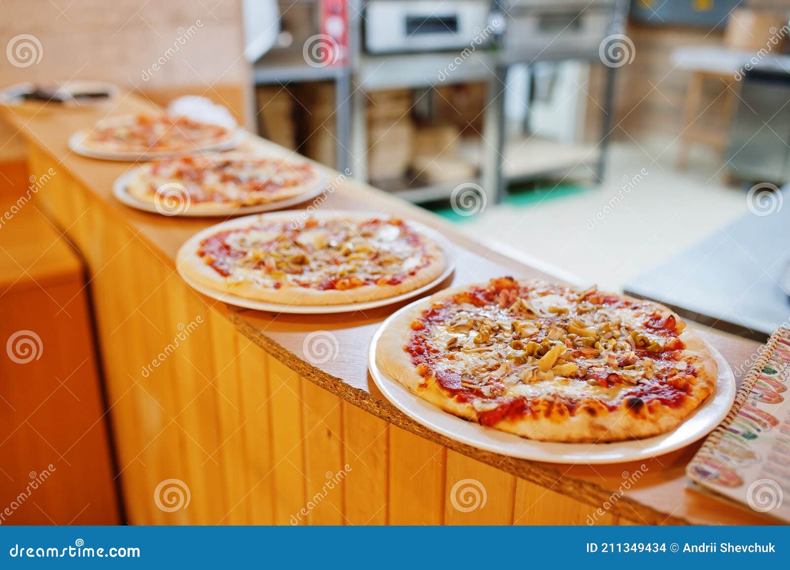 Four Pizza in Restaurant Kitchen Ready for Order Stock Photo - Image of ...