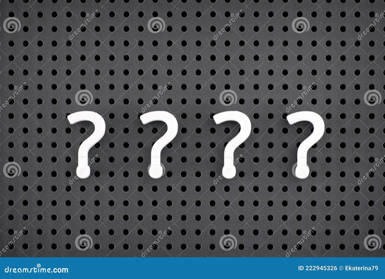Four Question Marks Spelled Out by White Symbol on Gray Pegboard Stock ...