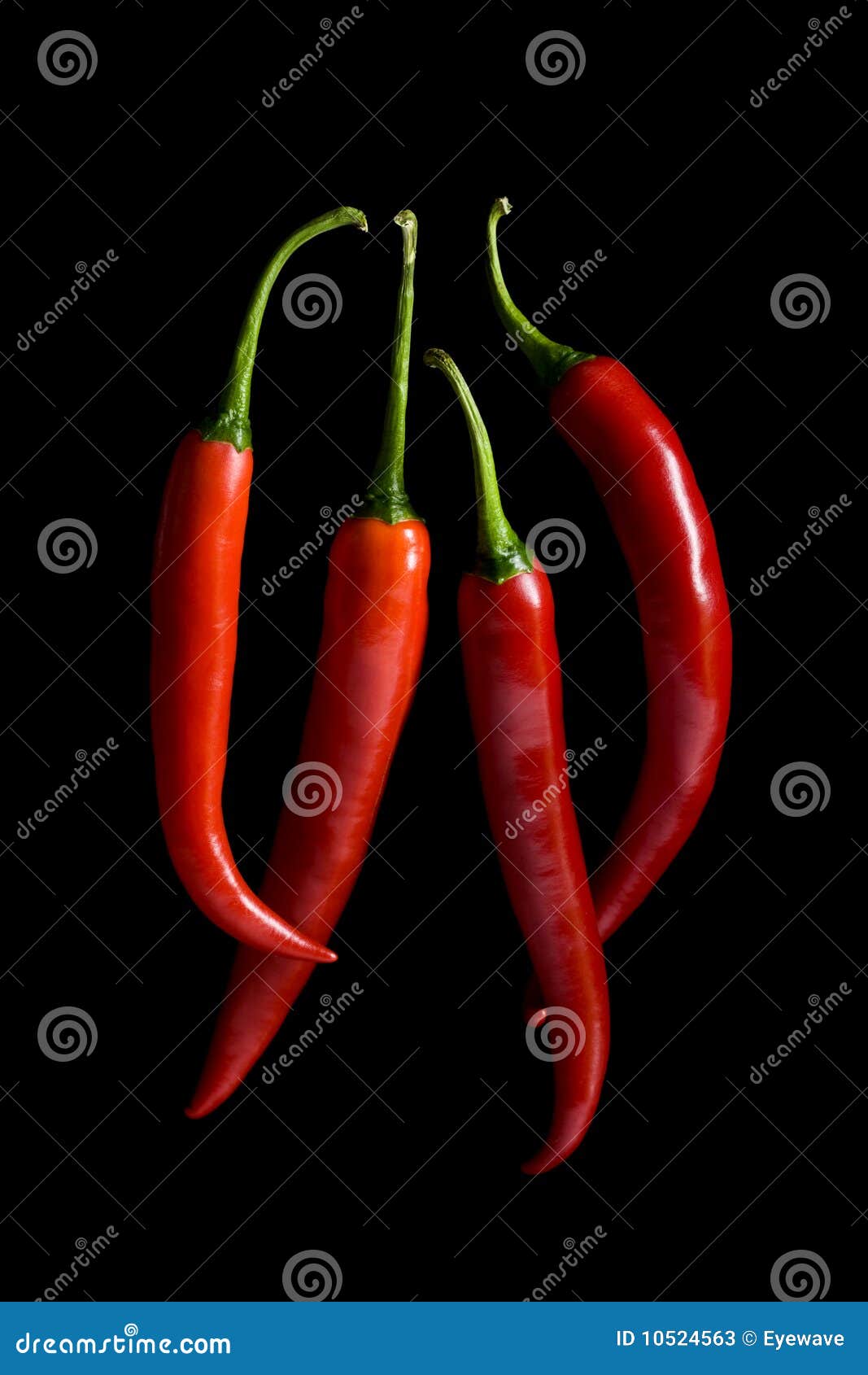 Four red chili peppers stock image. Image of backgrund - 10524563