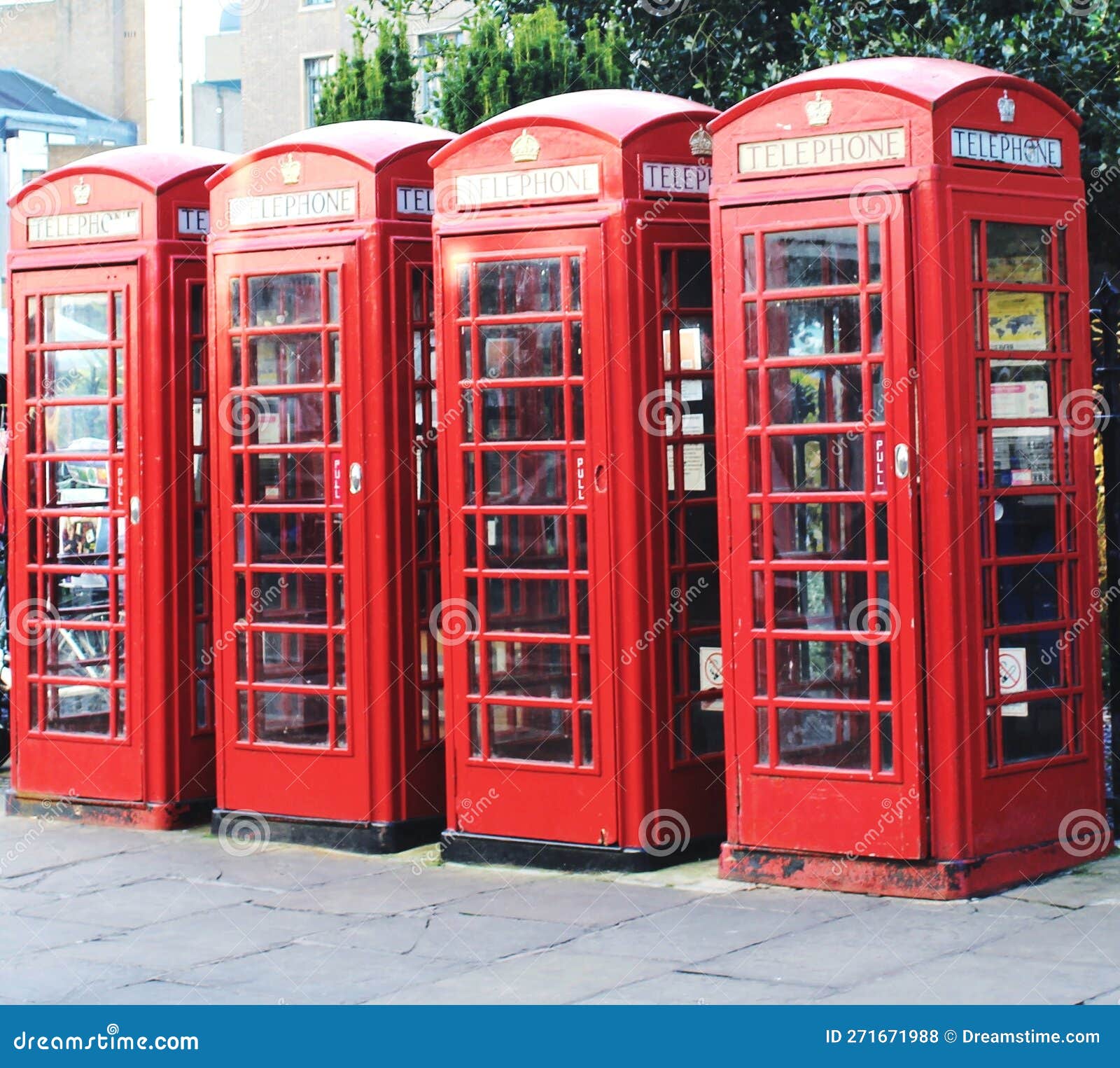 Four red phones booths. stock photo. Image of building - 271671988