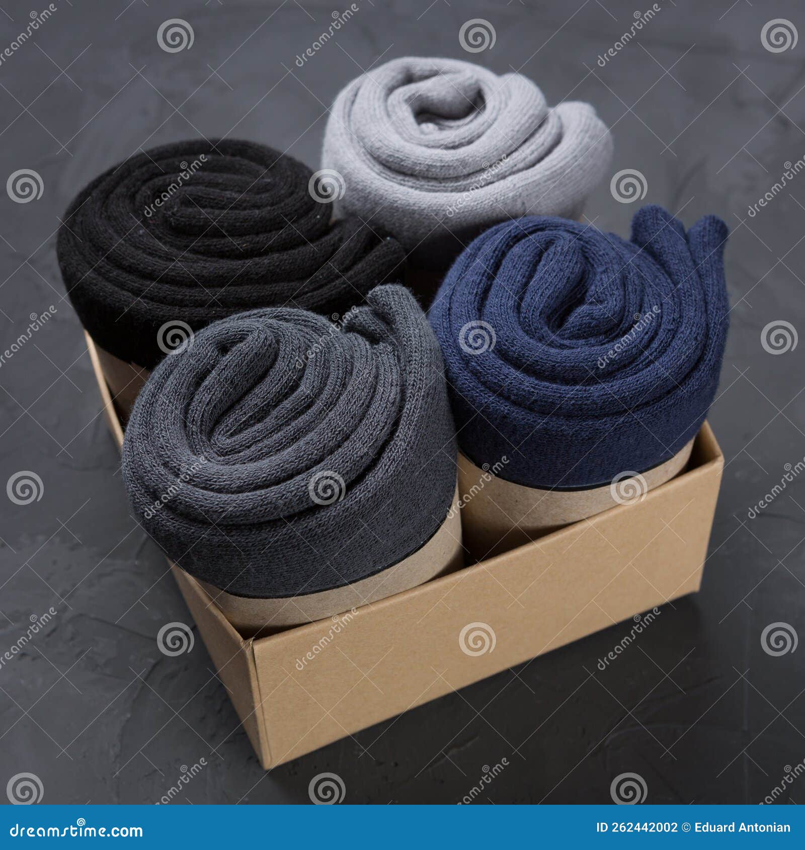 Four Rolled Up Men`s Socks in a Box, Concept Stock Photo - Image of ...