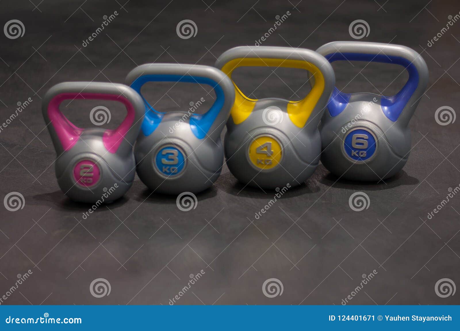 Four Several Plastic Weights of Different Weights and Colors Stock ...