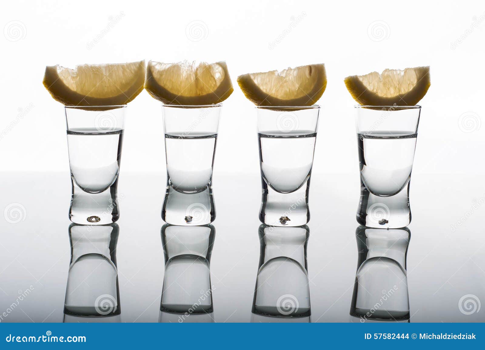 Four Shots of Vodka with Lemon Stock Photo - Image of cool, alcohol ...