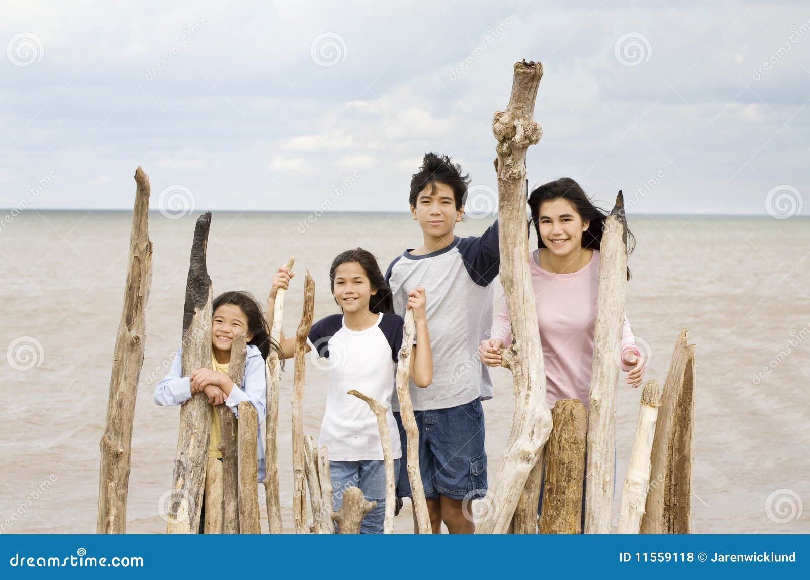 Four Siblings by the Lakeshore Stock Photo - Image of outdoors, girls ...