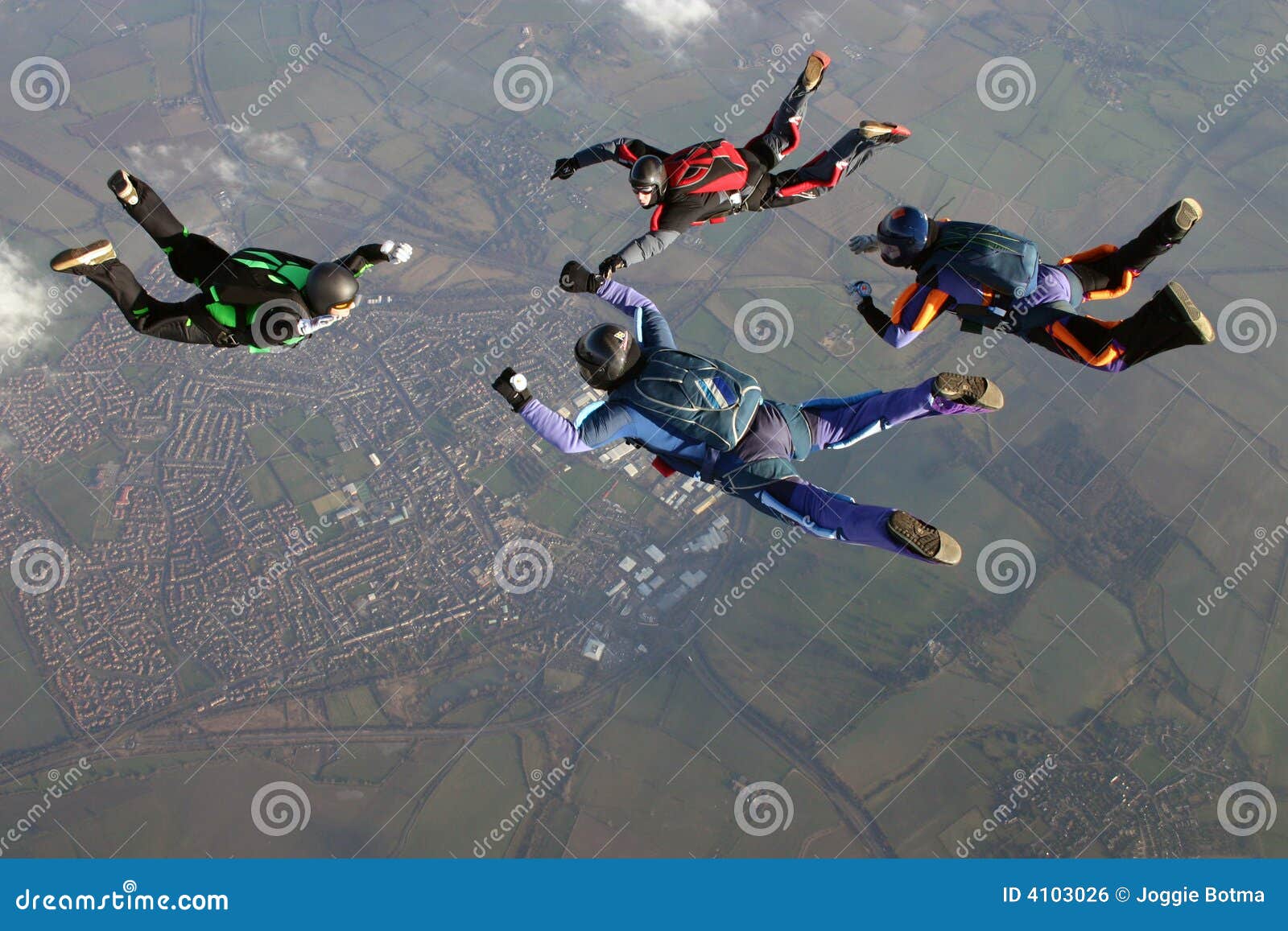 Four Skydivers Form a Formation Stock Photo - Image of jumping ...