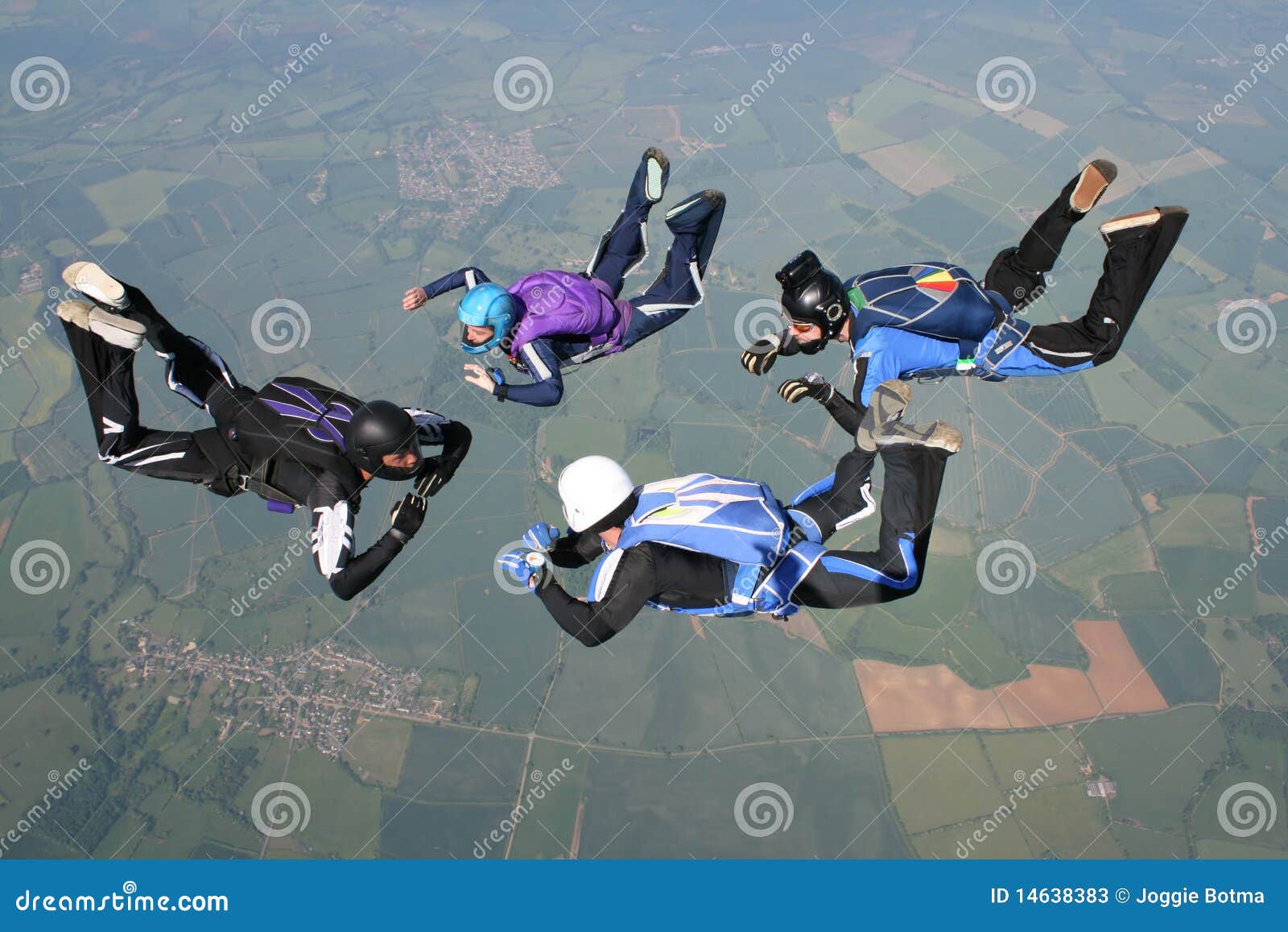 Four skydivers in freefall stock image. Image of skydivers - 14638383
