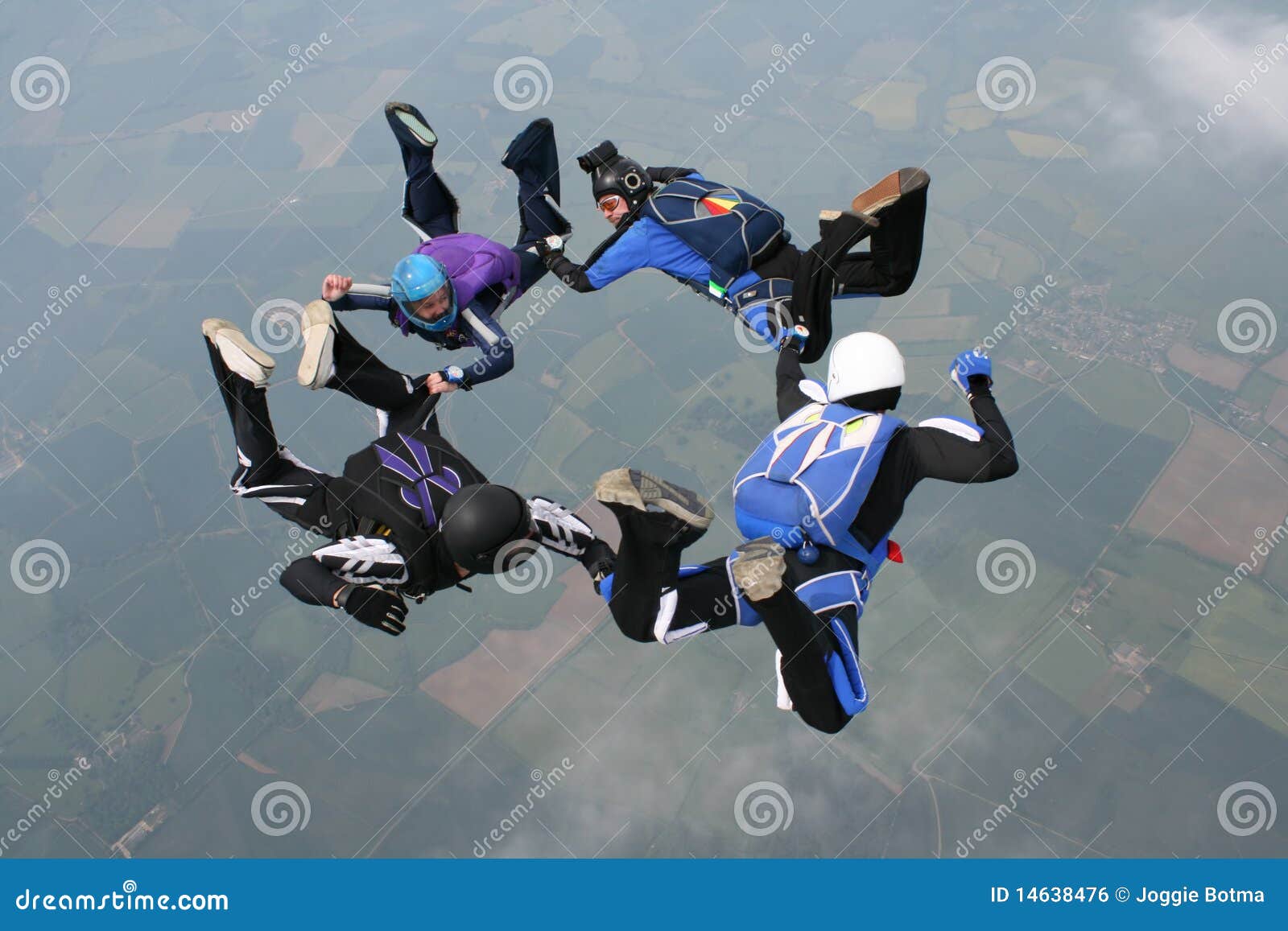 Four Skydivers in Freefall Forming a Circle Stock Photo - Image of ...