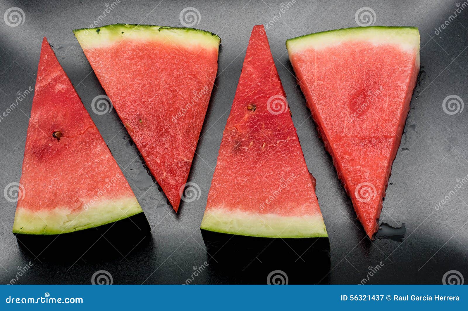 Four Slices of Watermelon Against Black Background Stock Image - Image ...