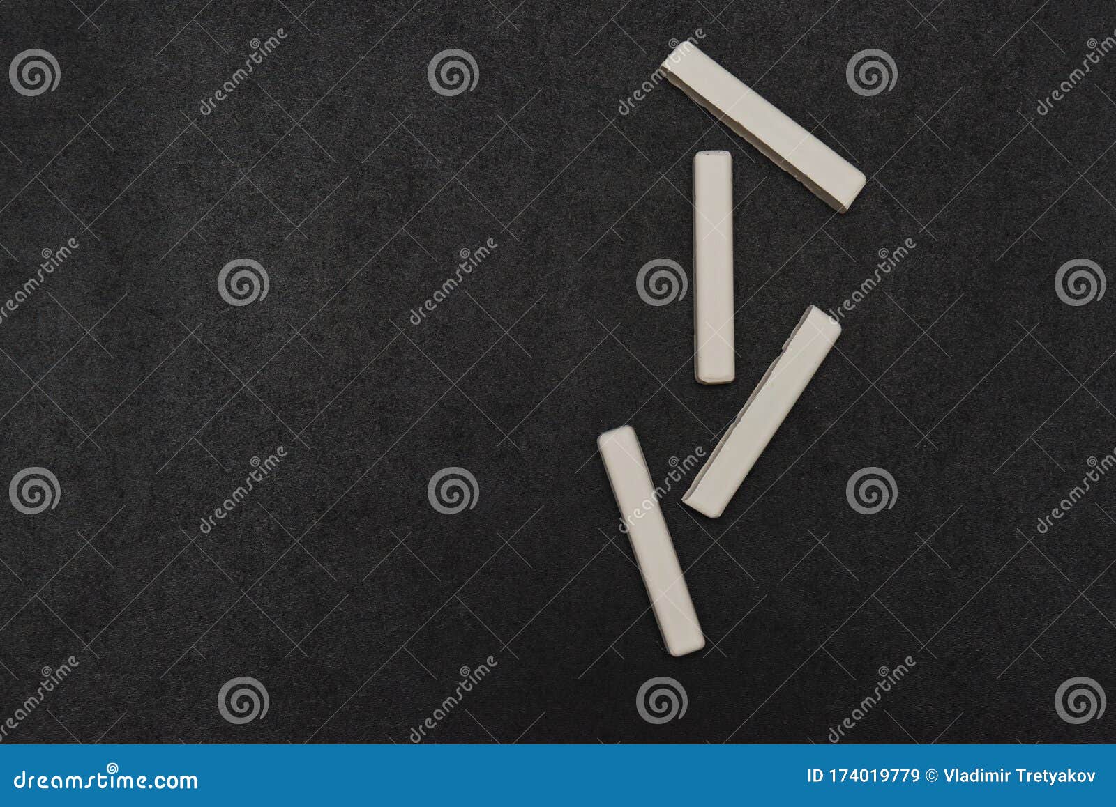 Four Small White Chalk on a Blackboard Background Stock Image - Image ...