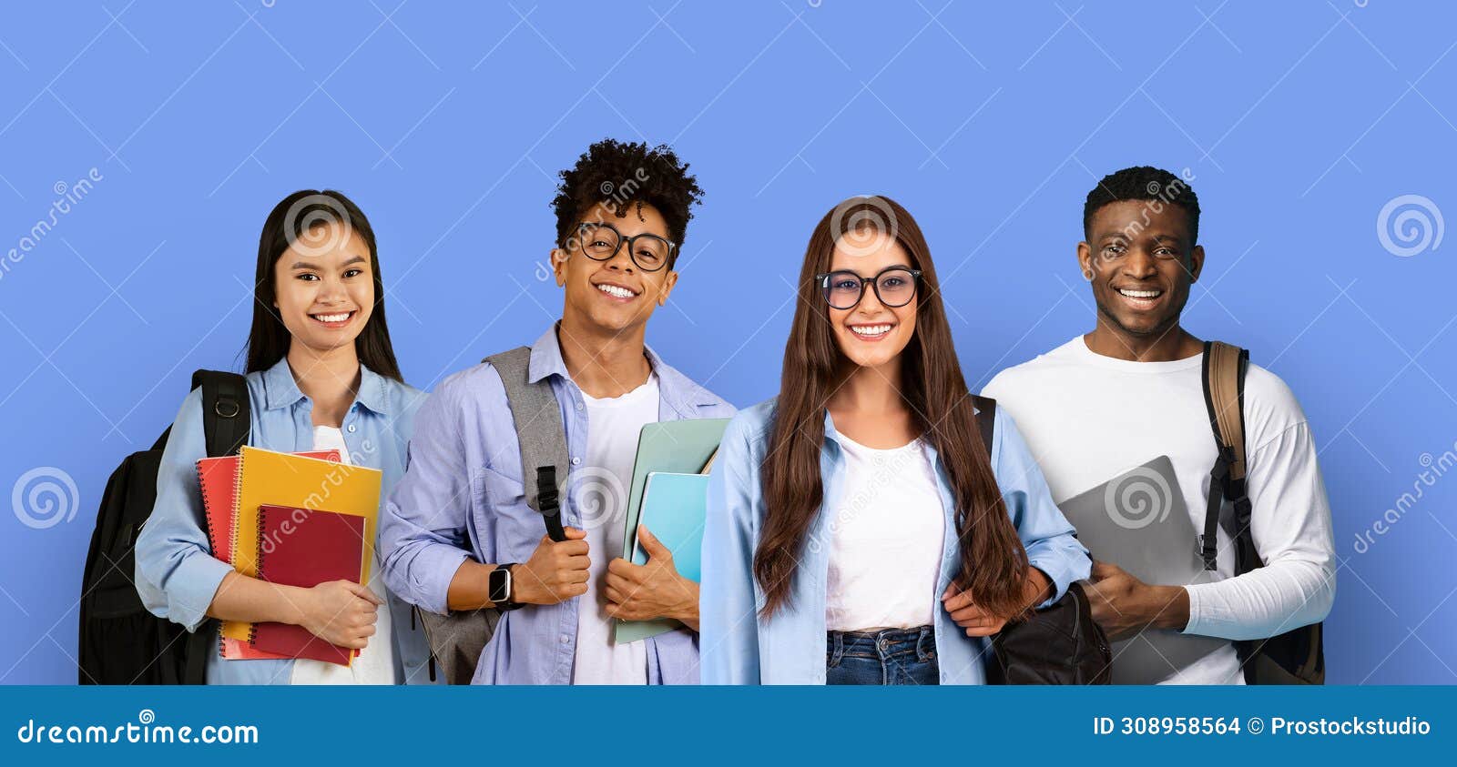 Four Smiling College Students with Textbooks and Backpacks Standing ...