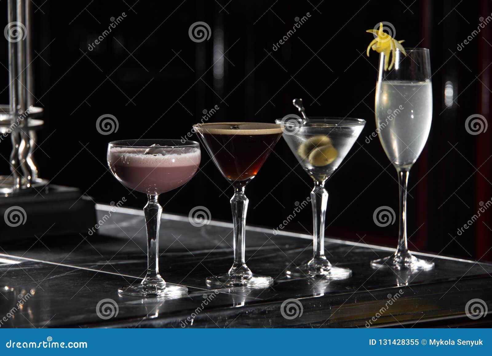 Four Special Cocktails On A Bar Desk. Black Background Royalty-Free ...