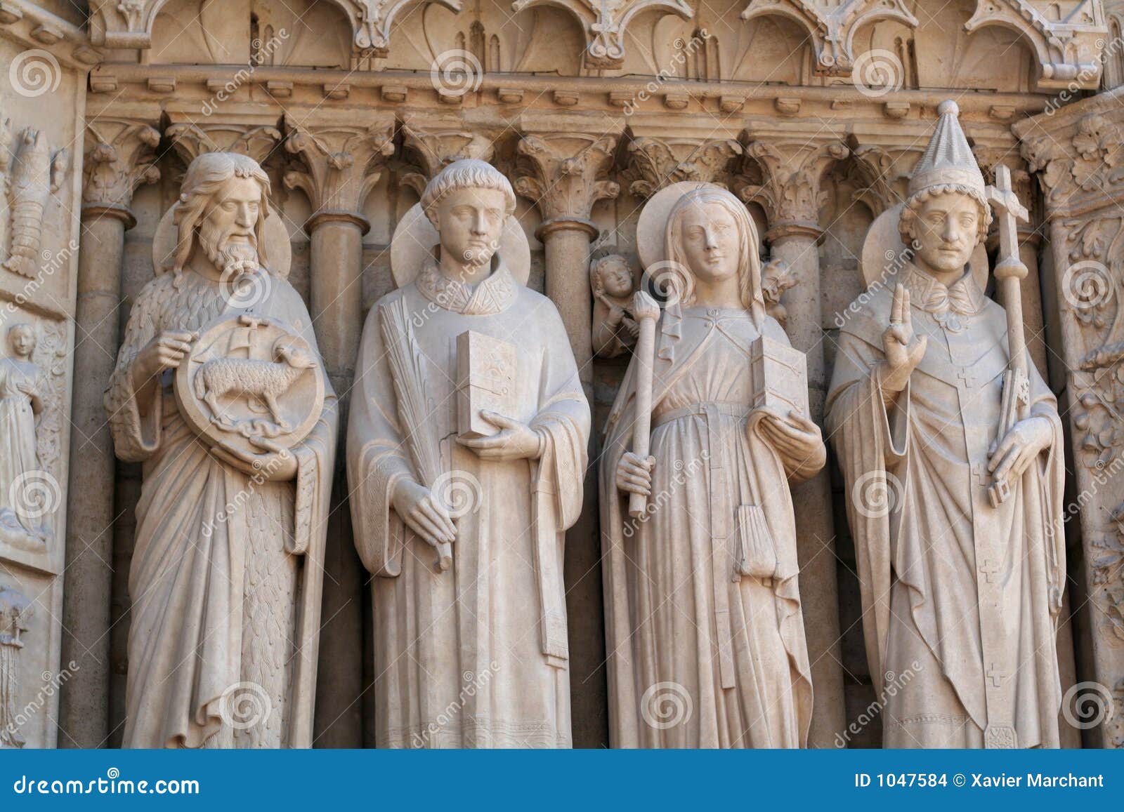 Four stone statues stock photo. Image of france, notre - 1047584