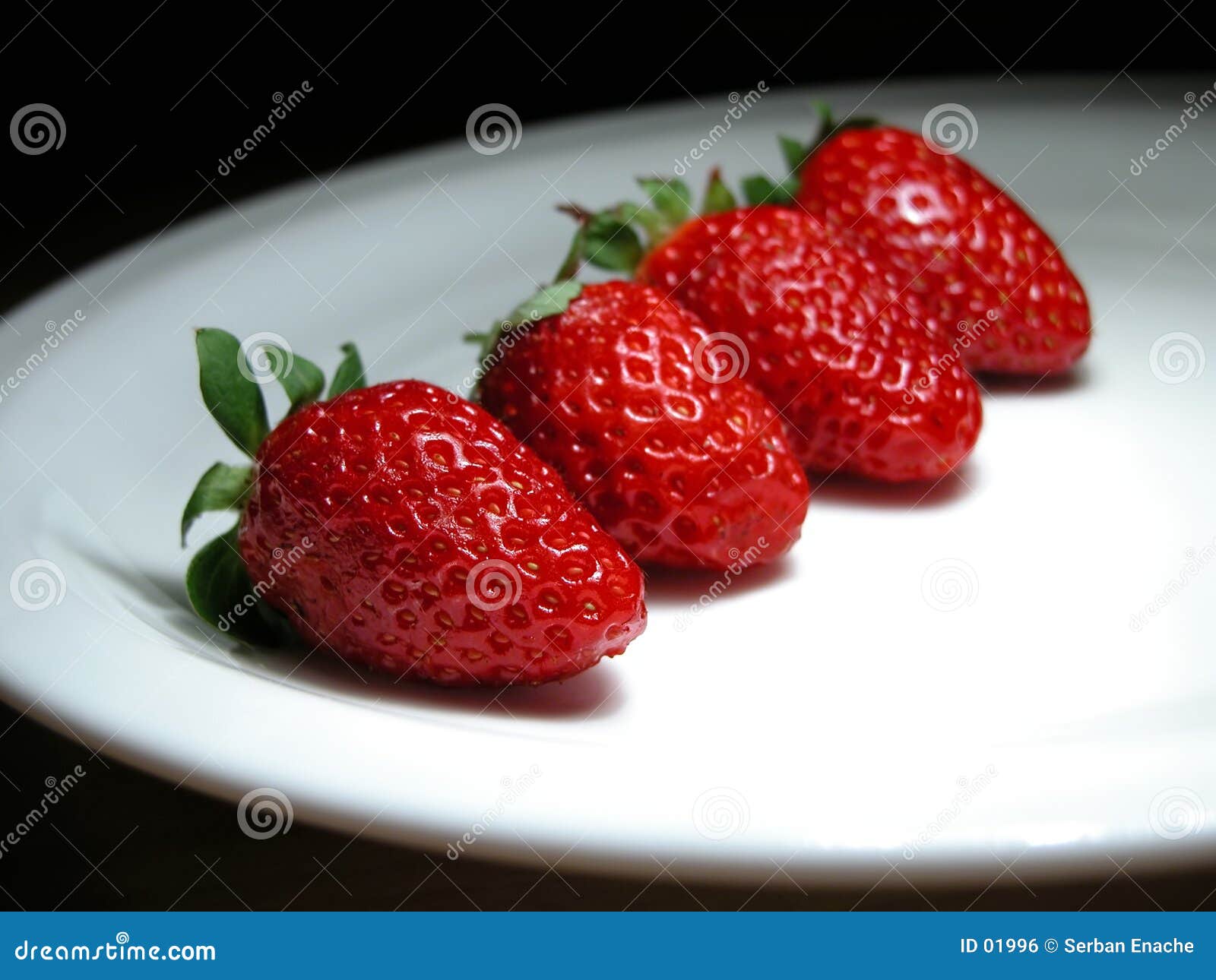 Four strawberries stock photo. Image of fruit, four, berry - 1996