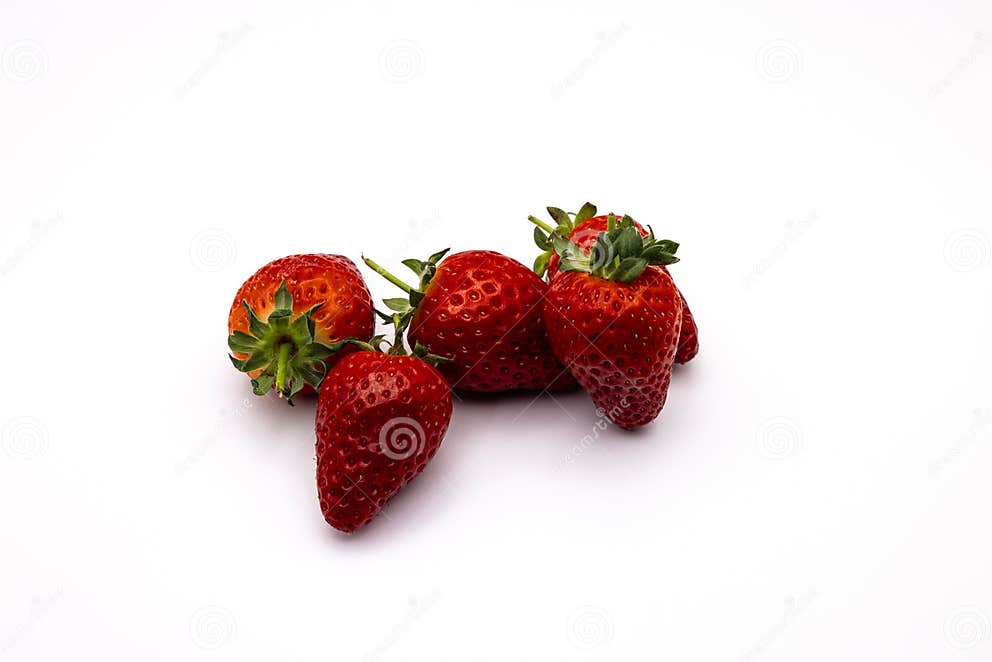 Four Strawberries Sit Side by Side on the White Surface Stock Image ...