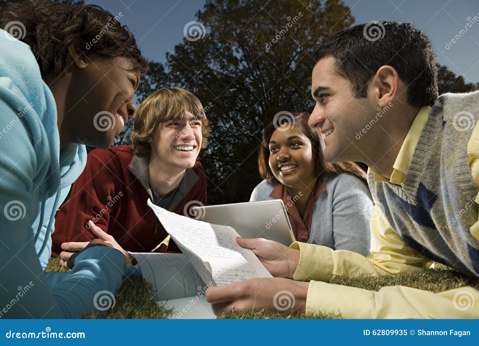 Four Students Studying Outdoors Stock Image - Image of looking ...