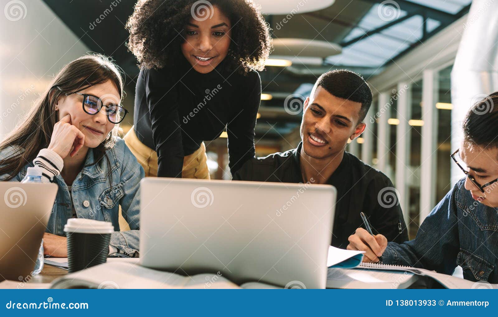 Four Students Using Laptop for Research at Library Stock Image - Image ...
