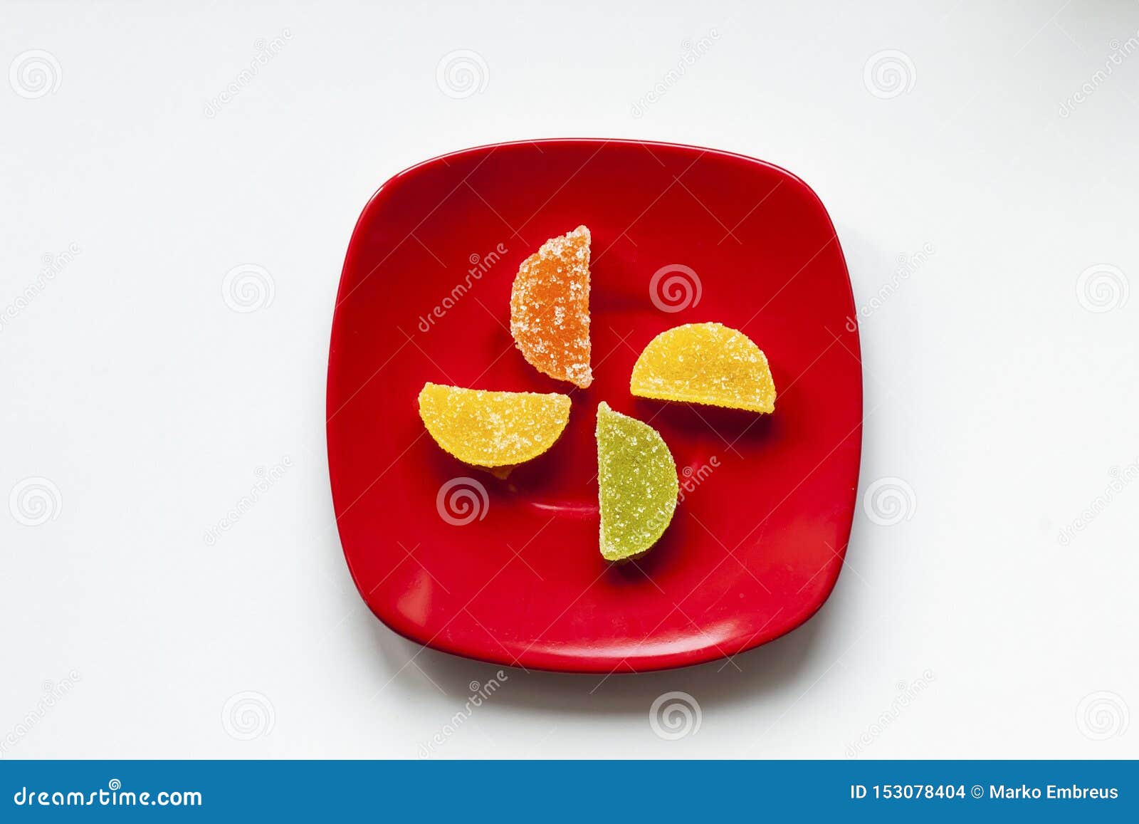 Four Sugar Candies on a Red Plate Stock Photo - Image of chewy, orange ...