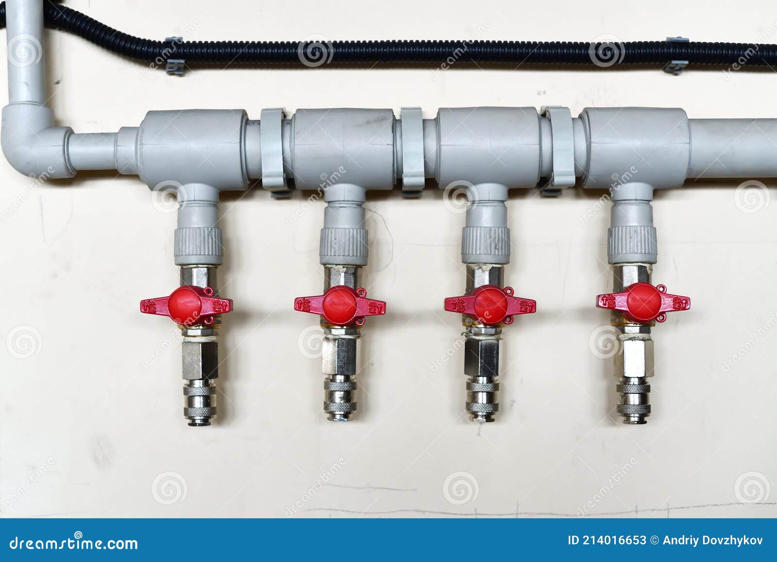 Four Taps for Water Supply are Fed into One System, Fixed on the Wall ...