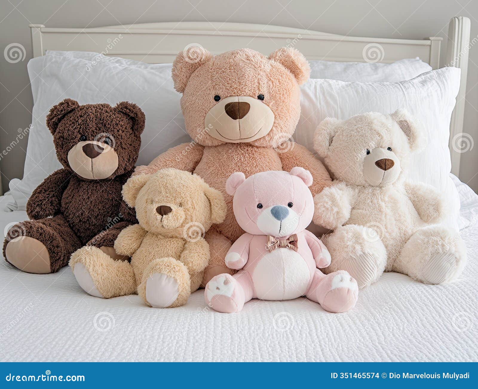 Four teddy bears on a bed stock photo. Image of brown - 351465574