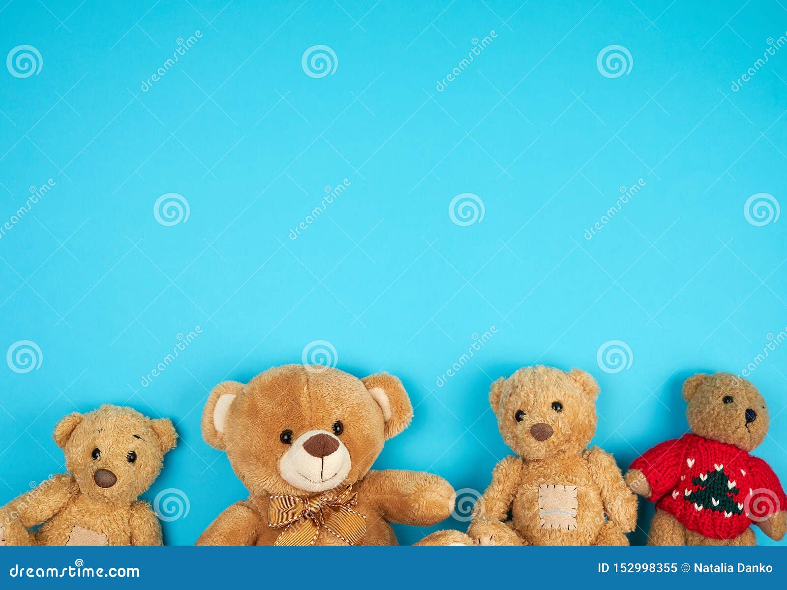 Four Teddy Bears on a Blue Background, Friendship Concept Stock Image ...
