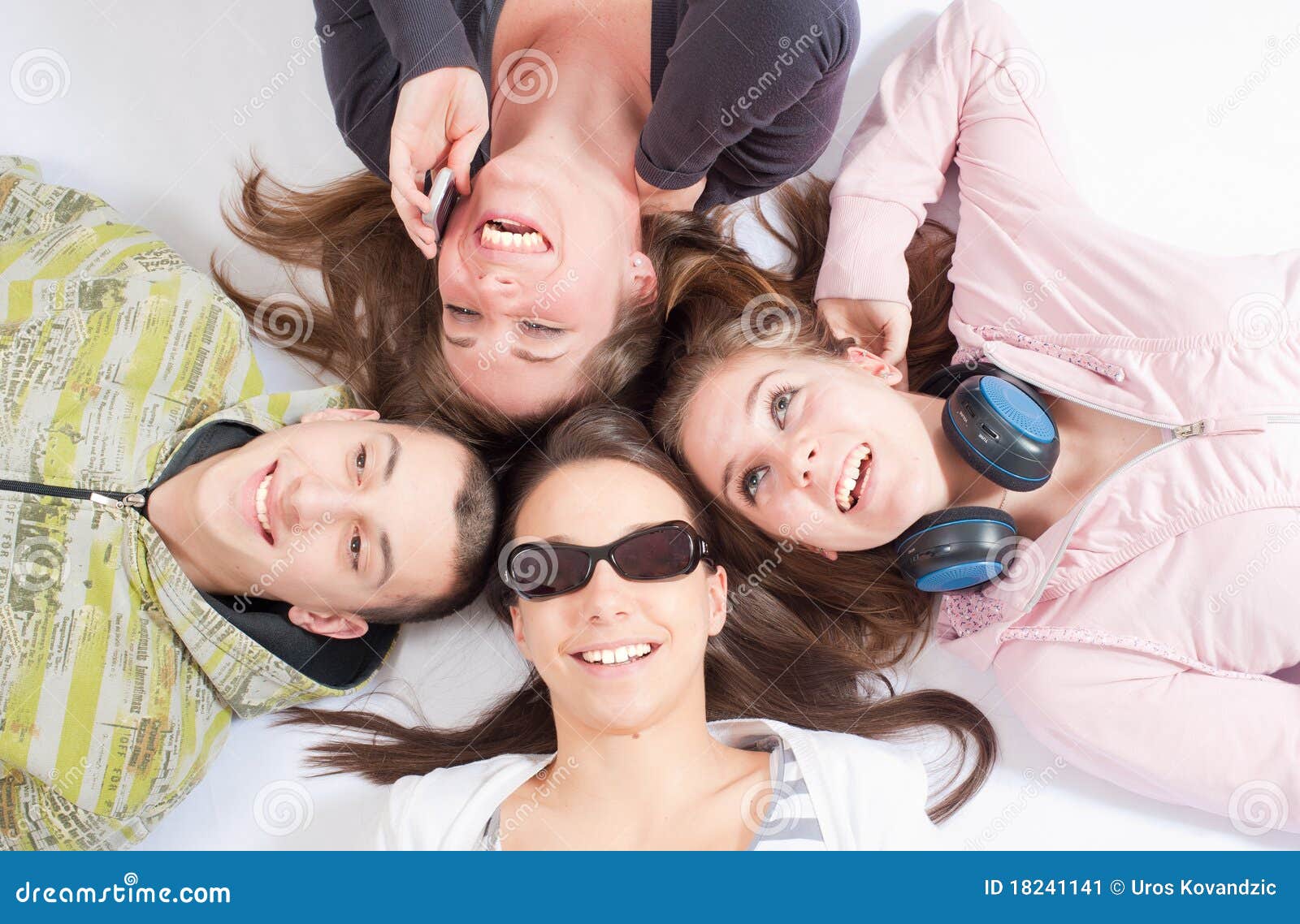 Four Teenagers Lying on White Stock Image - Image of happy, friends ...
